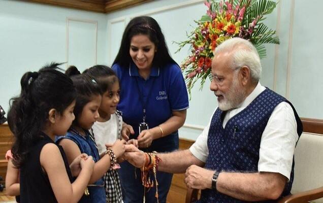 Widows from Vrindavan, students tie rakhi to PM Narendra Modi